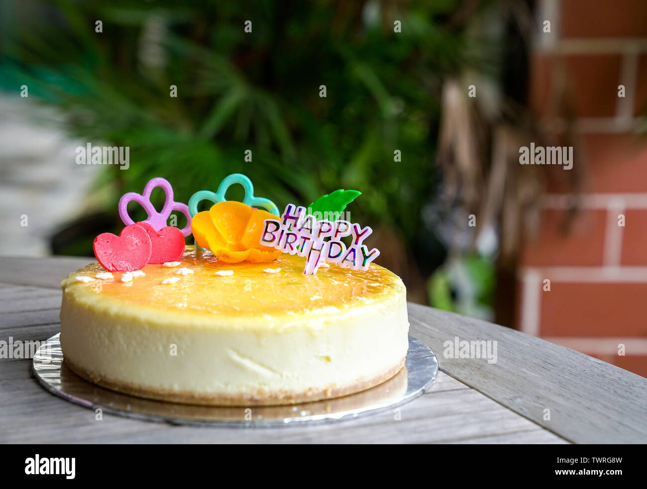 Cheese cake for birthday celebration Stock Photo - Alamy