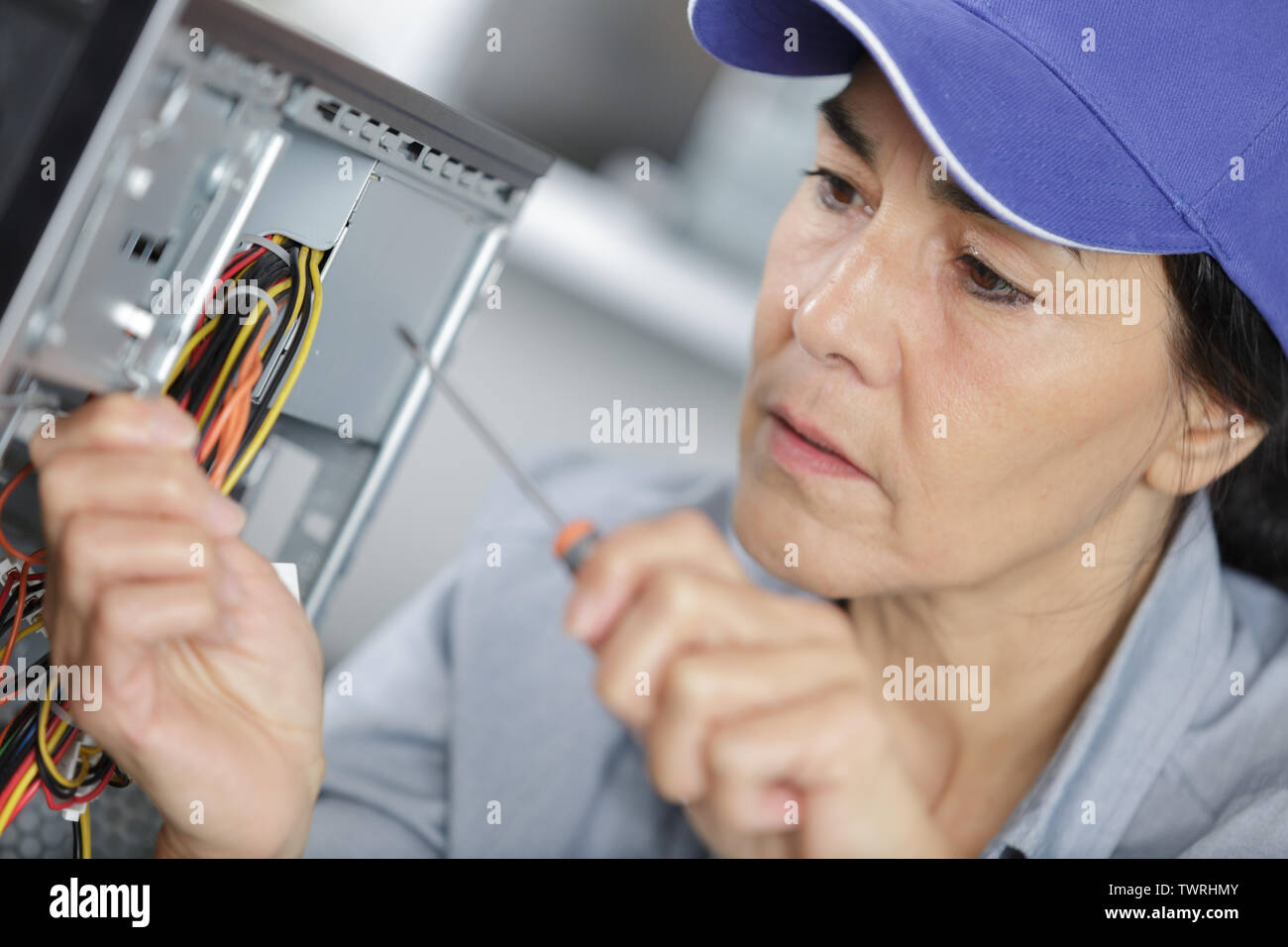 female technician repairing a computer Stock Photo - Alamy