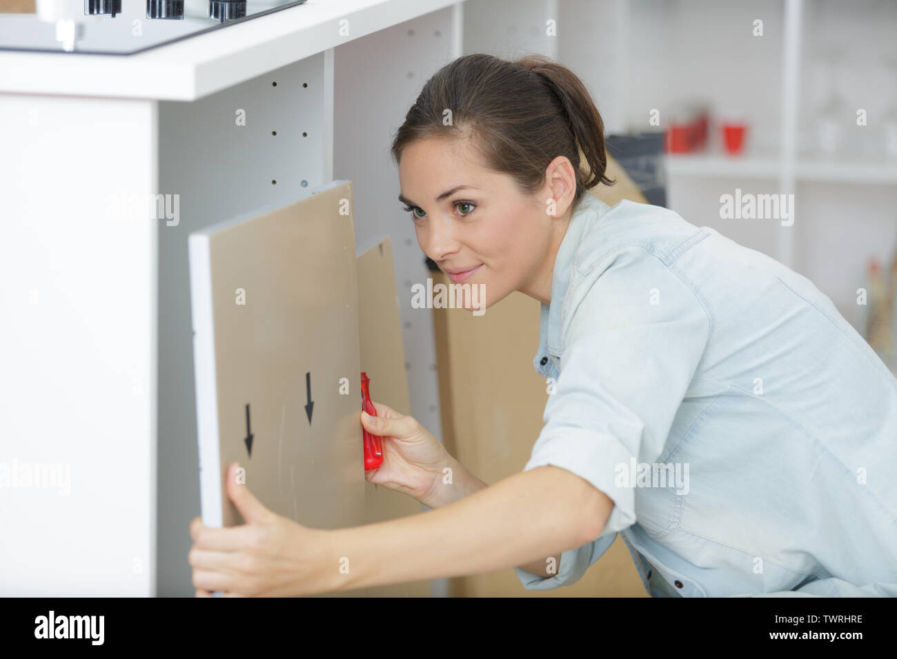 Woman electric using screwdriver hi-res stock photography and images ...