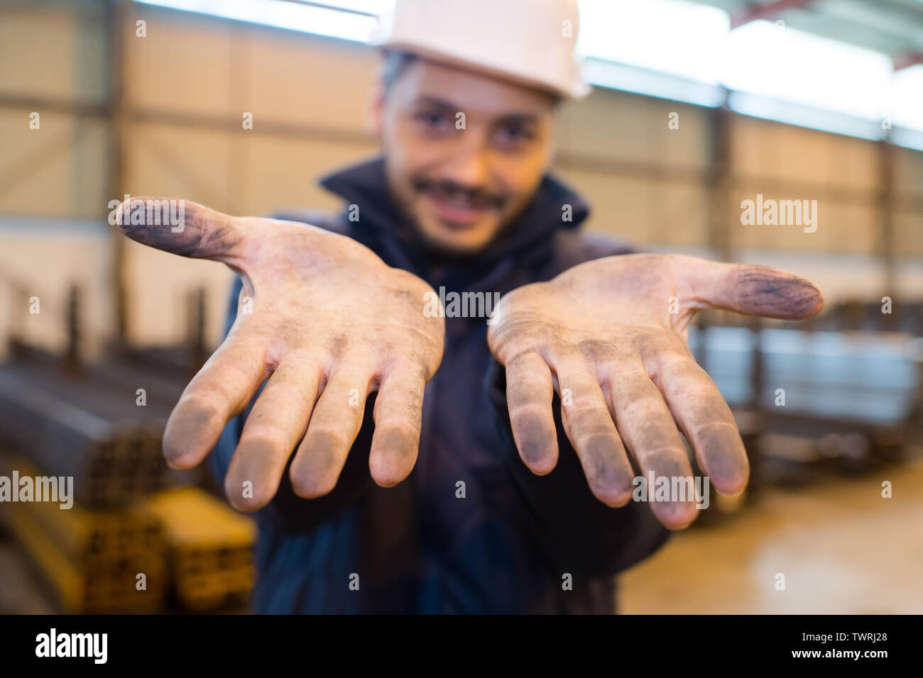 worker showing dirty hands Stock Photo - Alamy