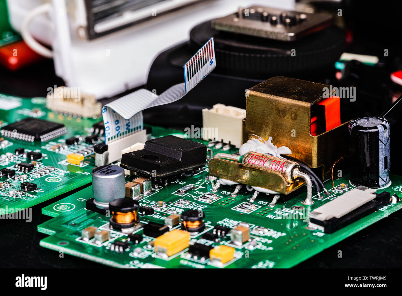 A Macro image of Circuit boards and other components of a broken-down ...