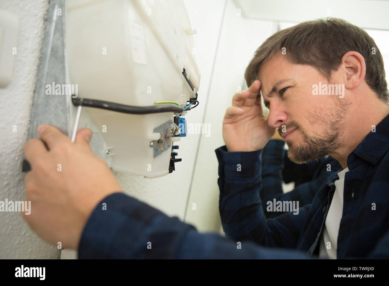 fixing a cable problem Stock Photo - Alamy