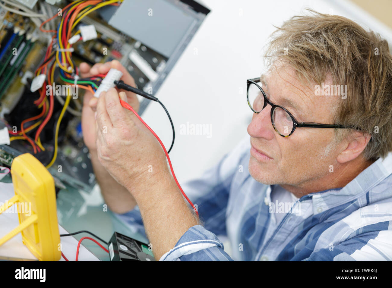 mature technician repairing computer Stock Photo - Alamy