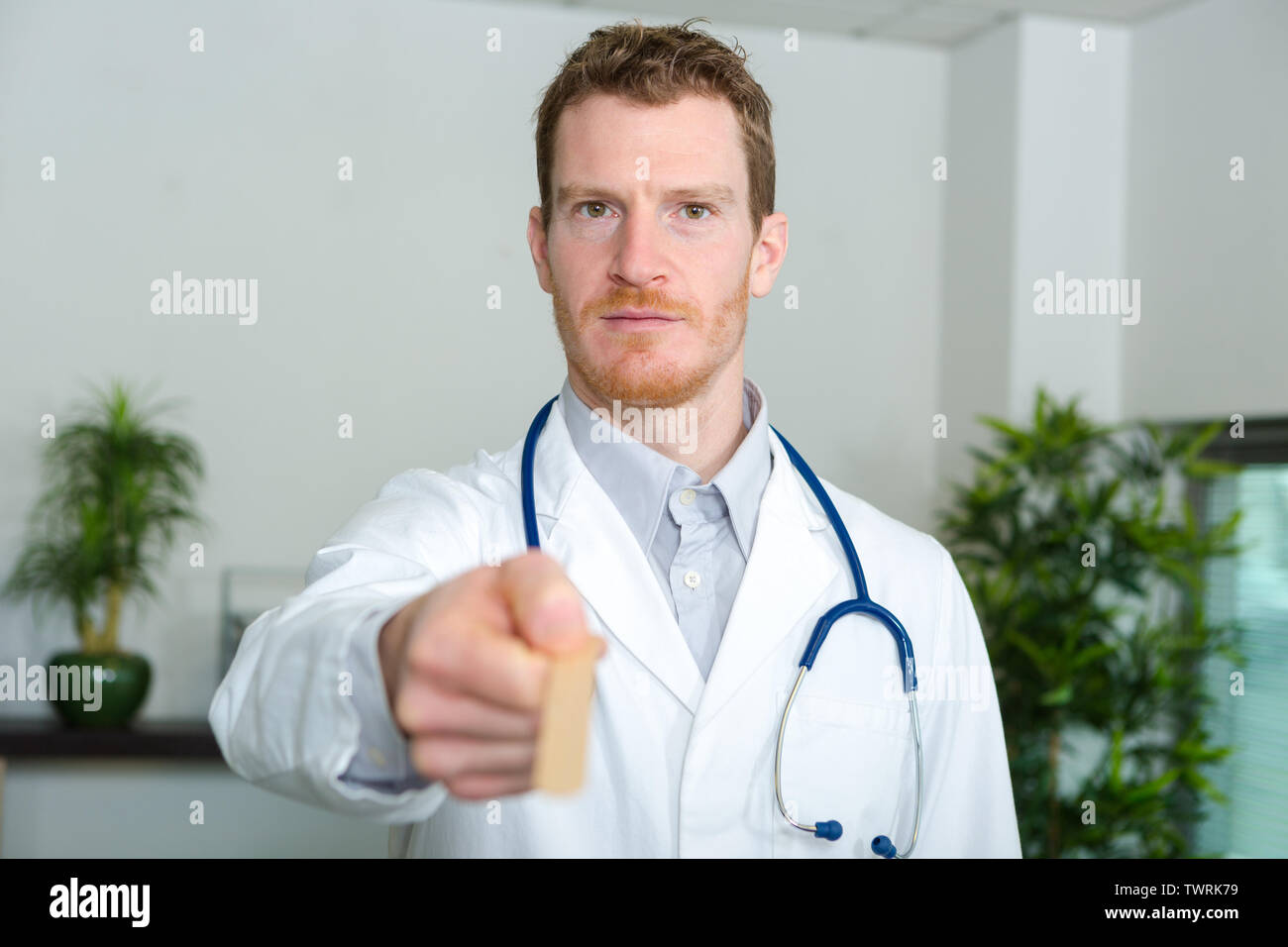 doctor examining patients tonsils Stock Photo - Alamy