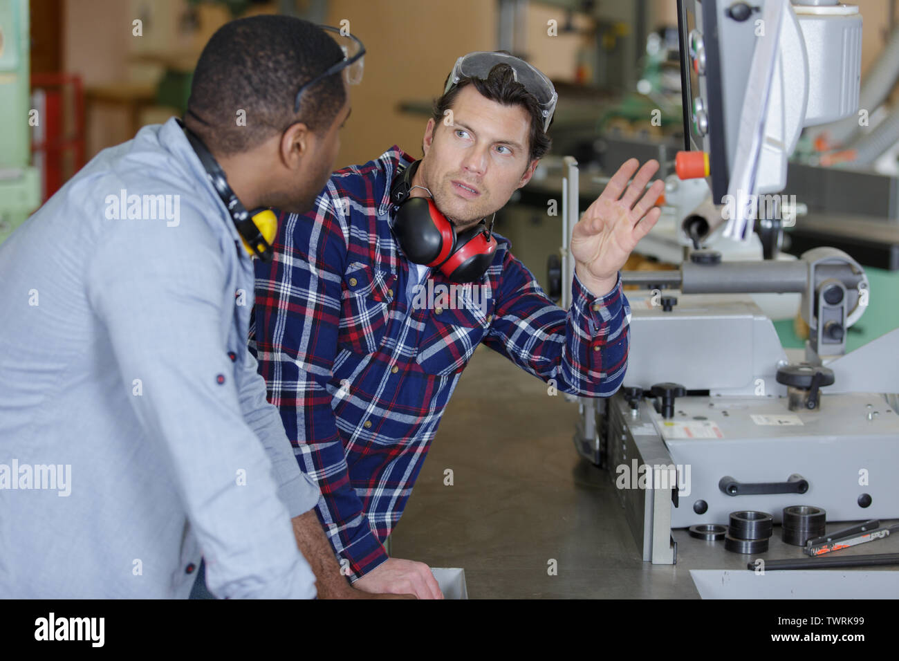 two workers workers in warehouse Stock Photo - Alamy