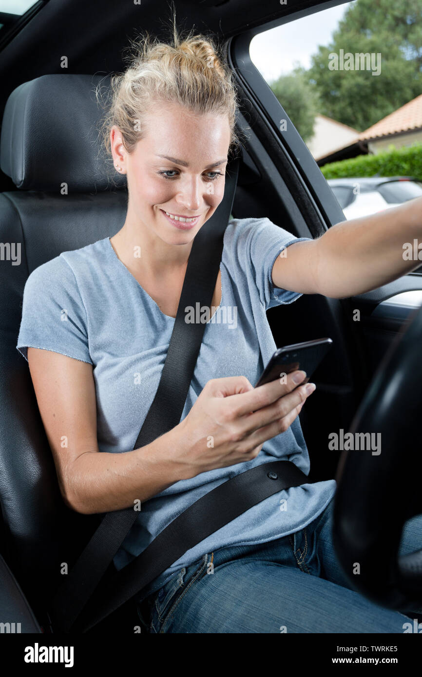 distracted woman driver on her mobile device Stock Photo - Alamy