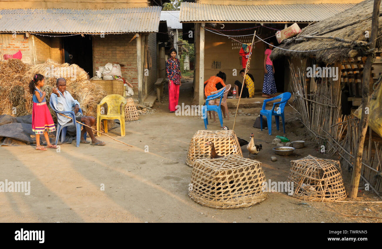 People of Tharu ethnic group in family's home compound near Chitwan ...