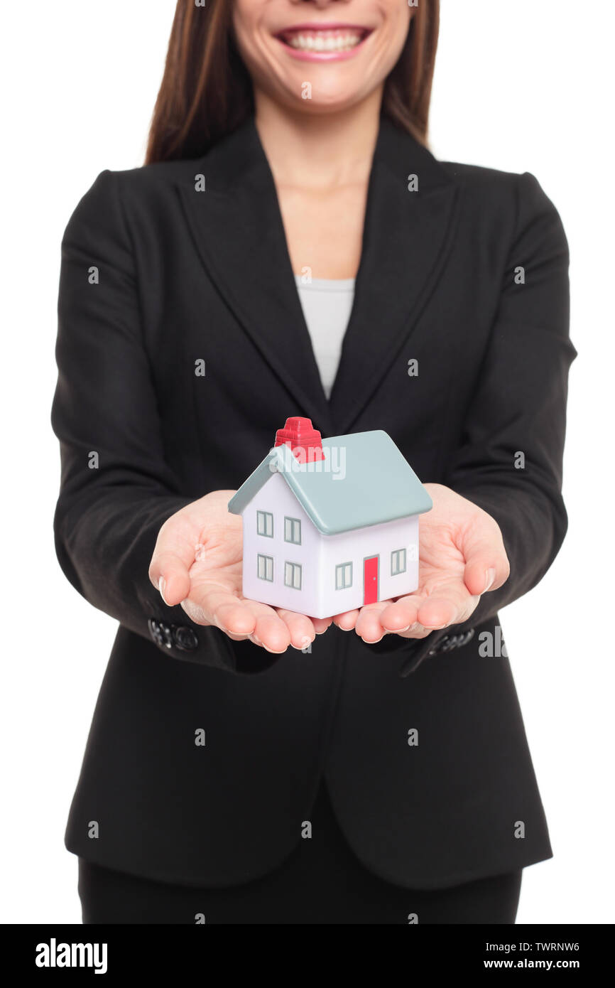 Real estate agent showing new house in mini size. New home owner ...