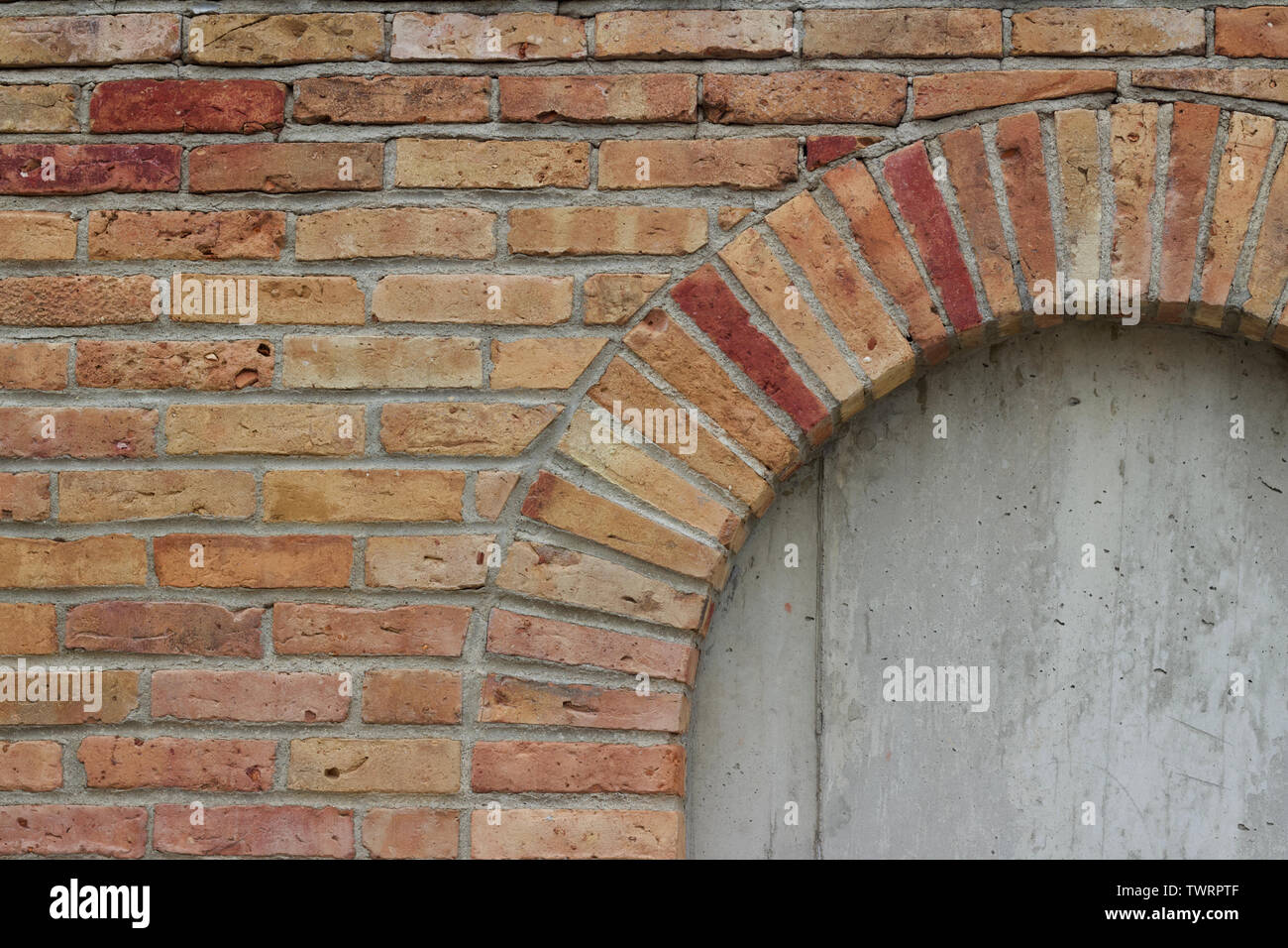 Attractive old rugged beige brick wall peppered with colorful bricks in ...