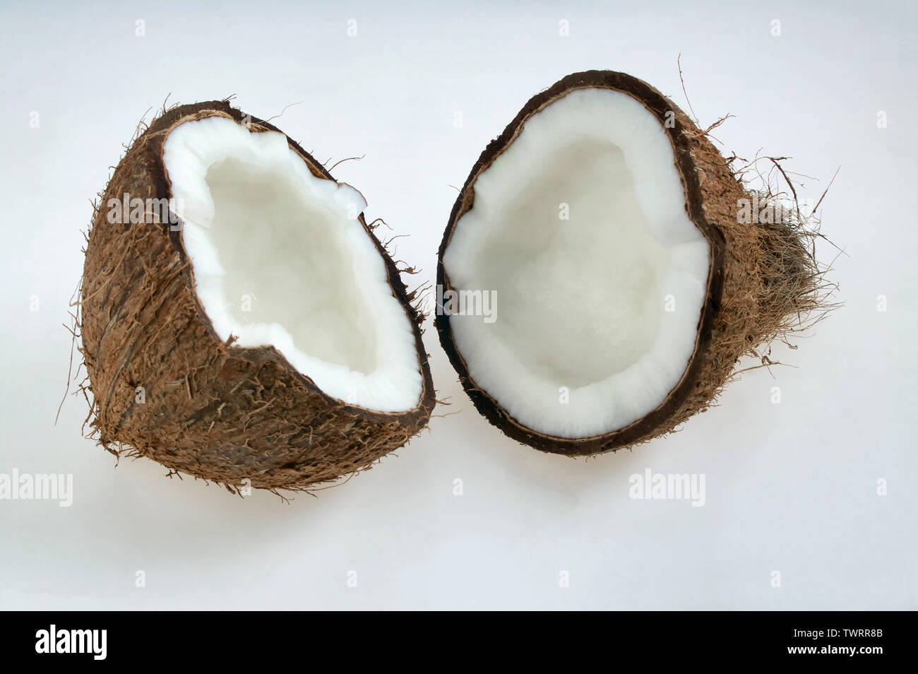 FOOD coconut halves Stock Photo - Alamy