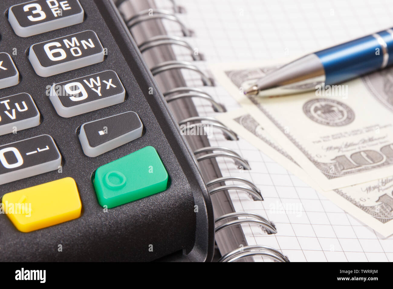 Payment terminal, notepad for writing notes and money. Business concept ...