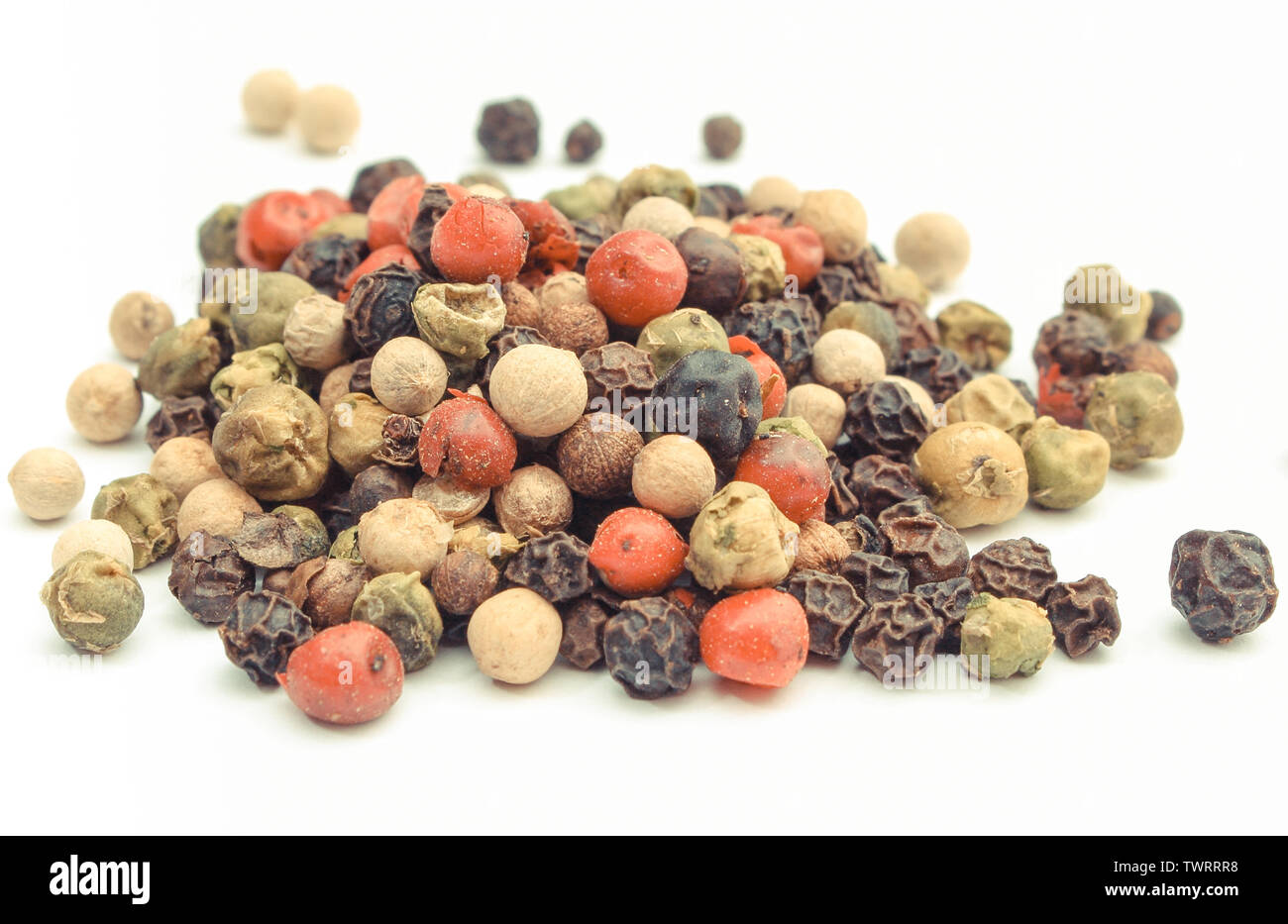 Colored pepper on white background. Healthy cooking spice concept Stock ...