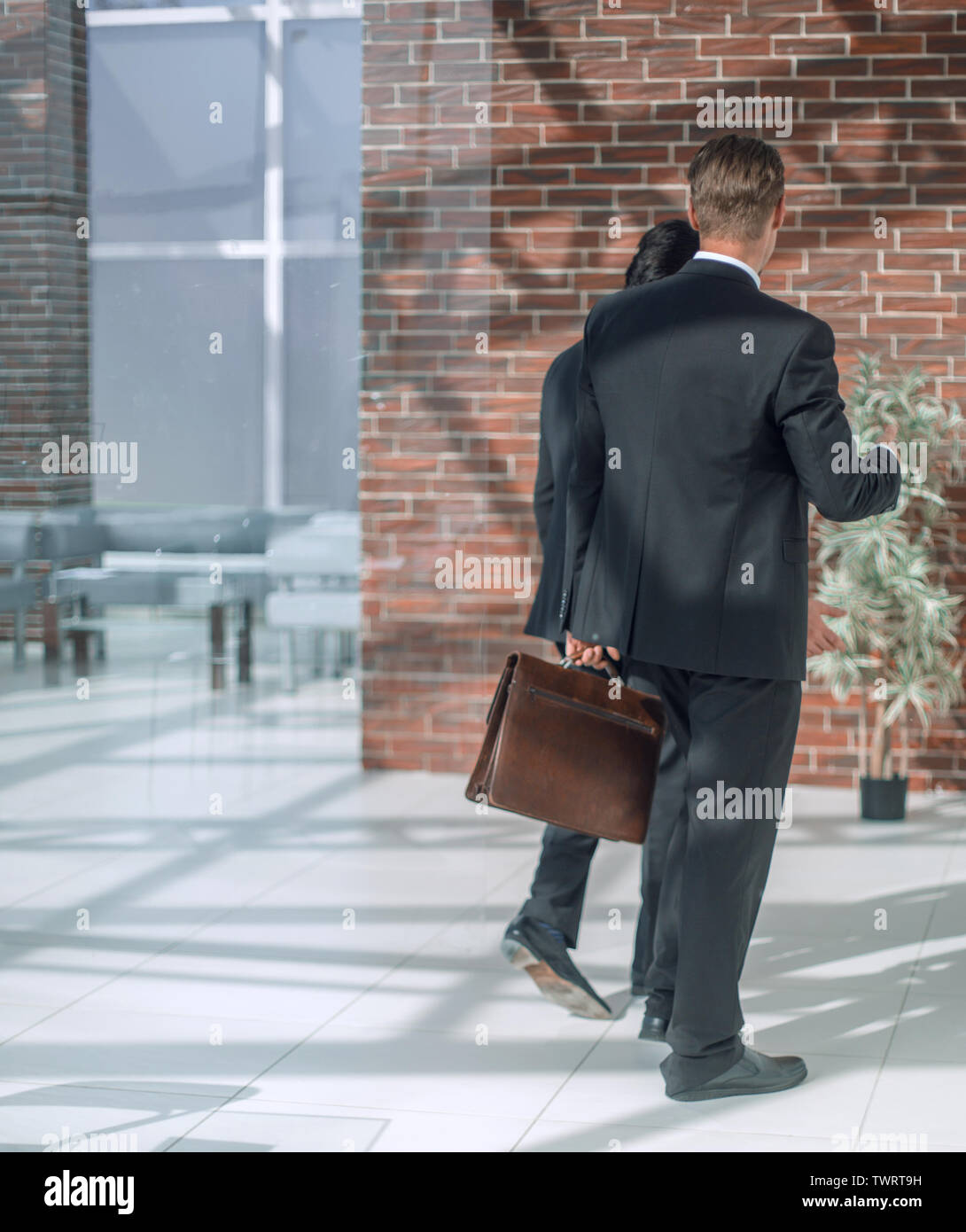 Successful executive going office hall hi-res stock photography and images - Alamy