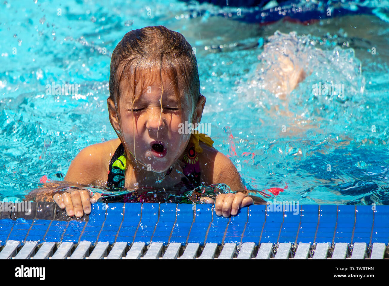 Kid swimming kick hi-res stock photography and images - Alamy