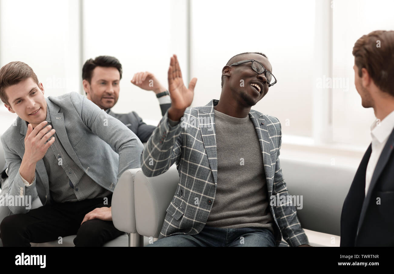 close up.cheerful co-workers giving each other a high five Stock Photo ...