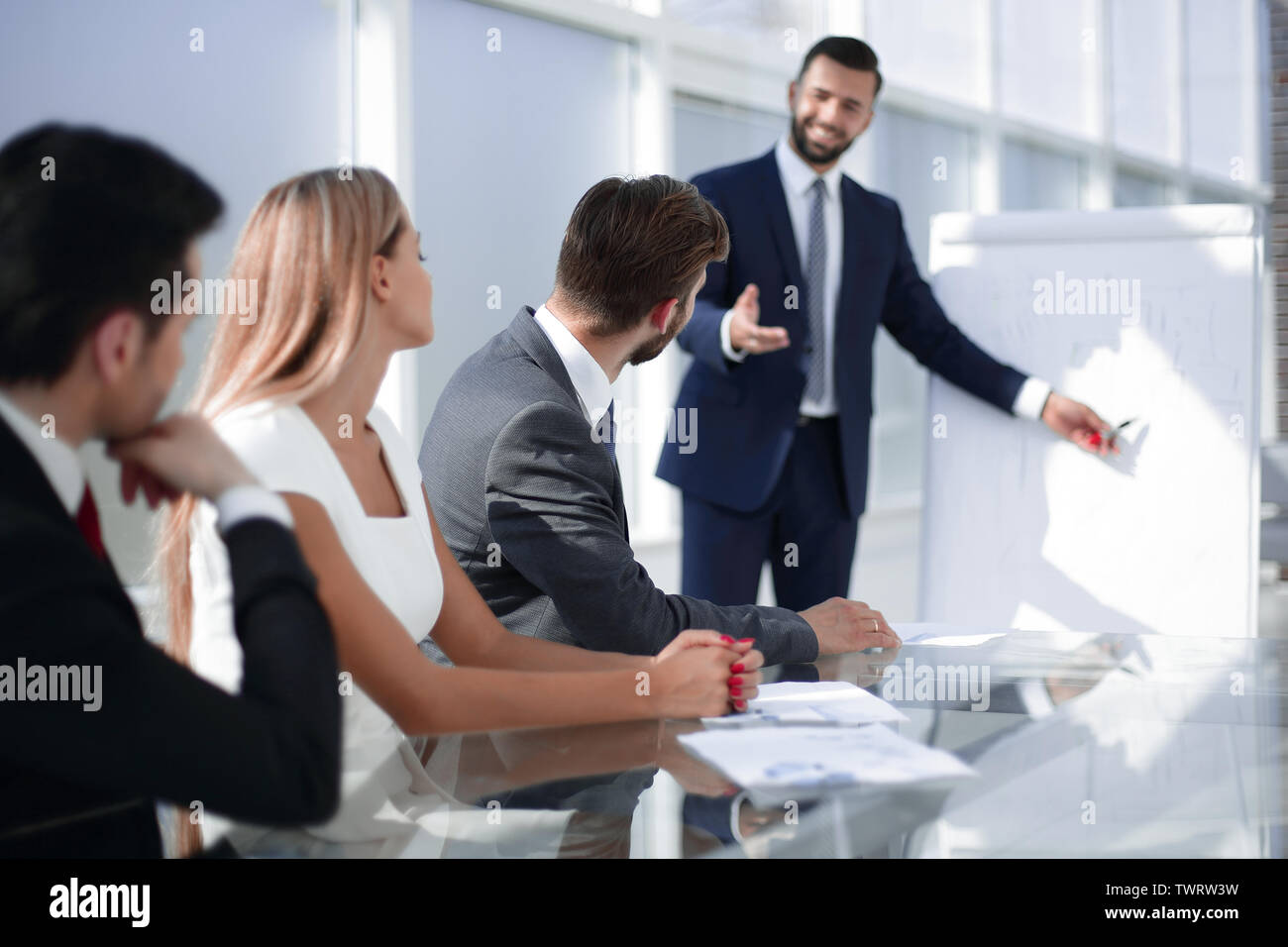 team leader reporting about work explaining result on flipchart Stock ...