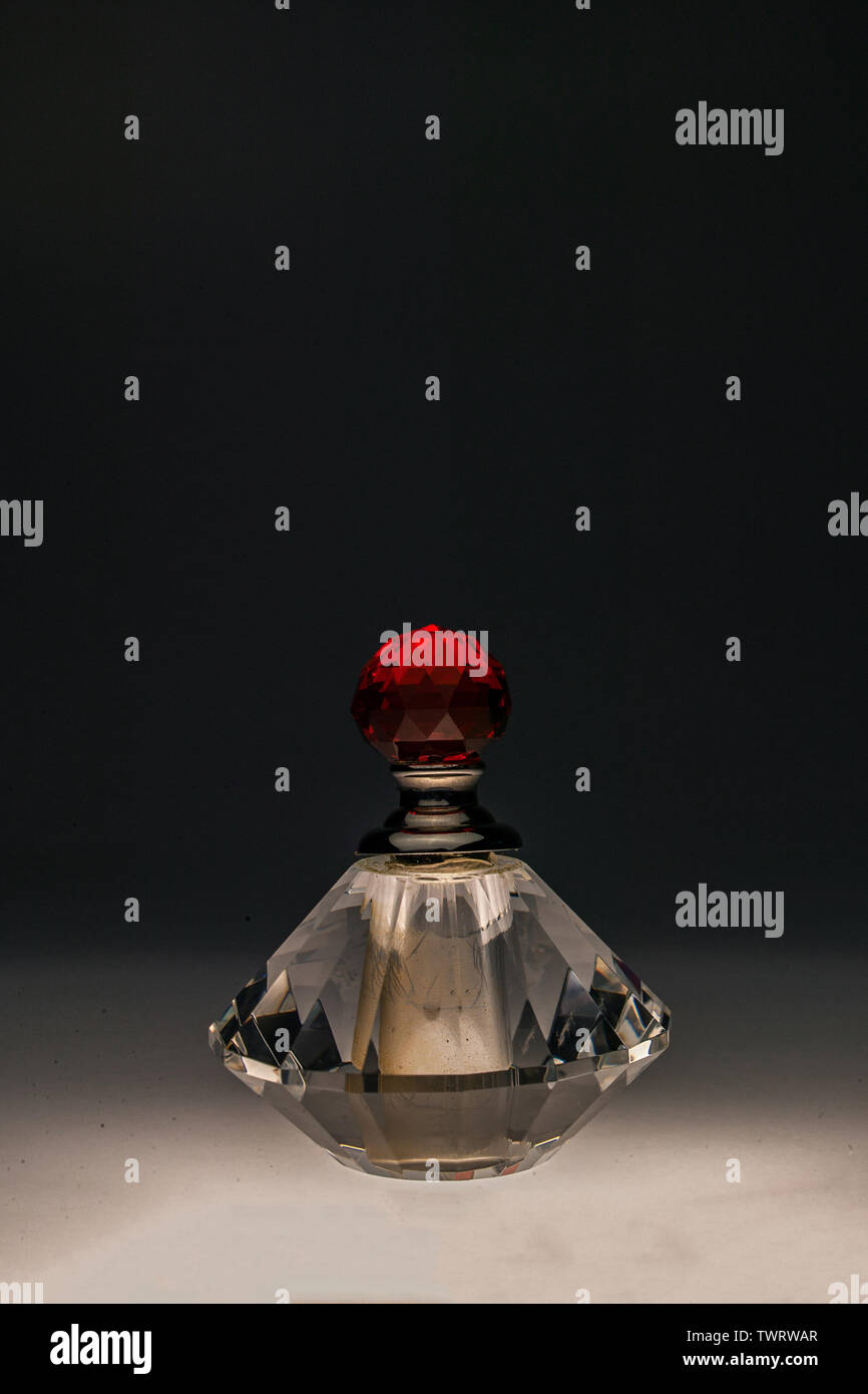 Crystal Perfume Bottle red top Stock Photo - Alamy