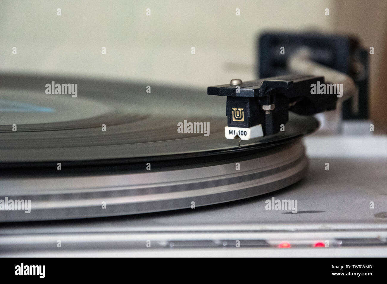 Black vynil record playing with blurry back ground Stock Photo - Alamy