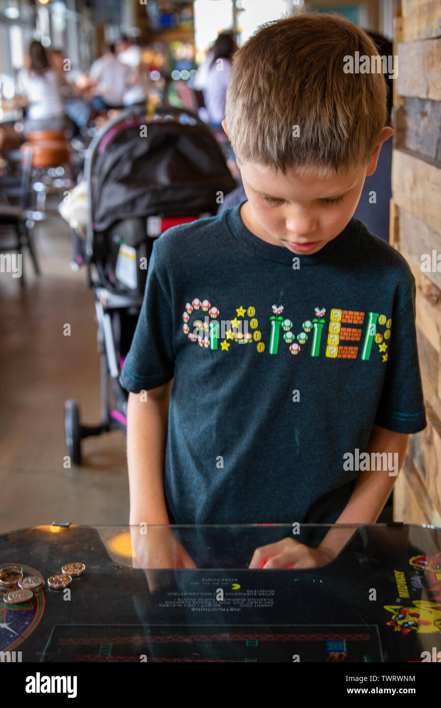 Boy playing video game Stock Photo - Alamy