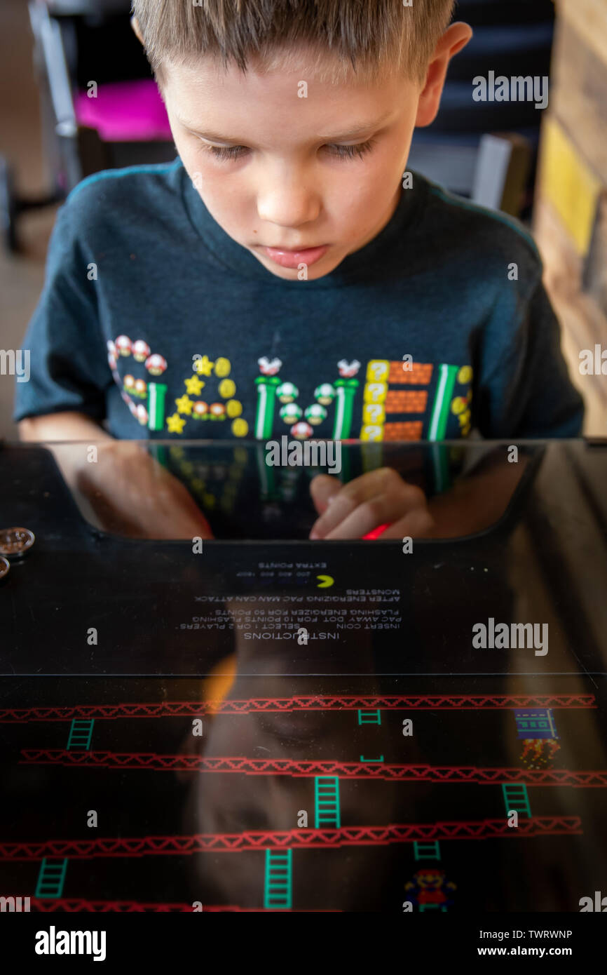 Boy playing video game Stock Photo - Alamy