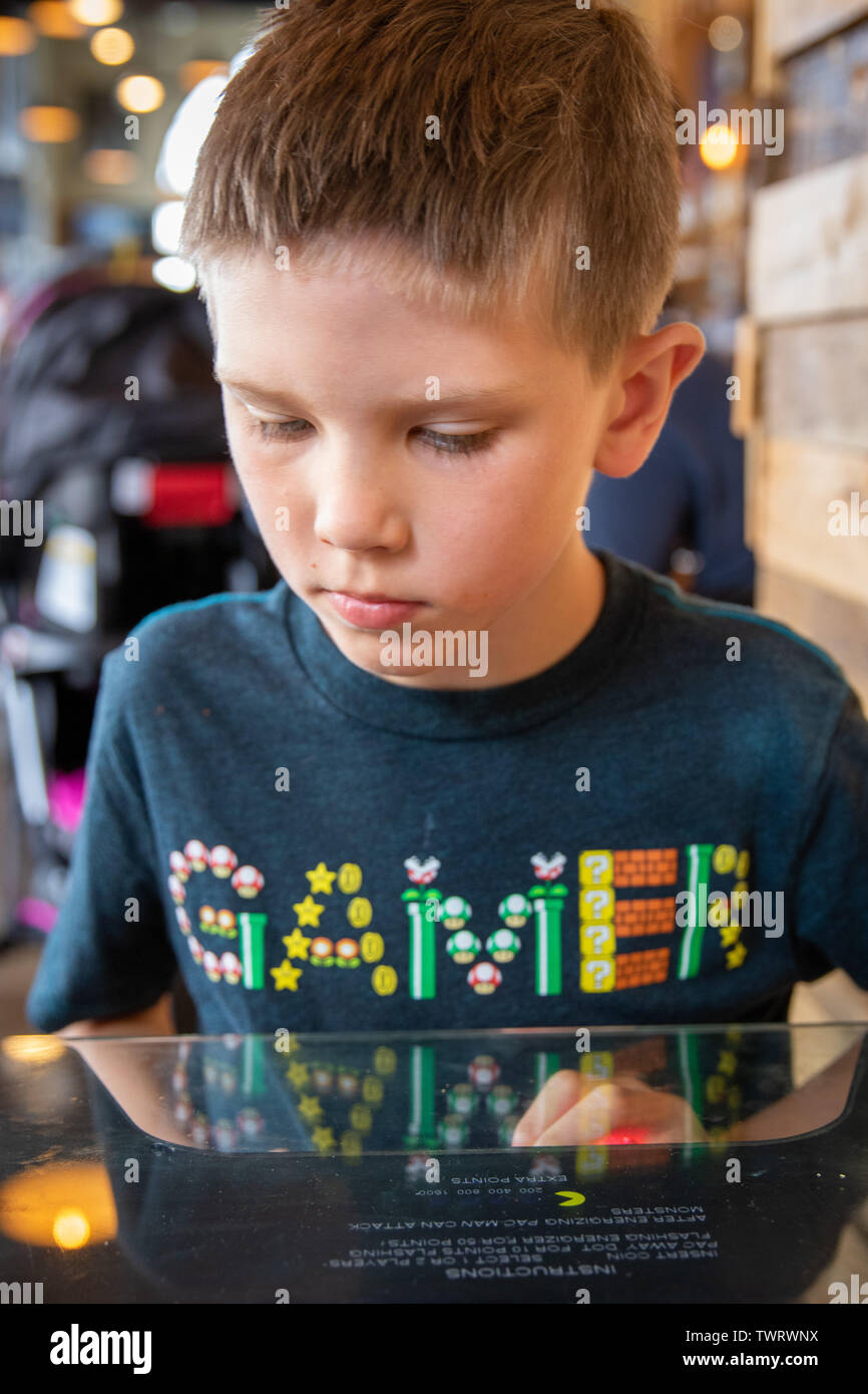 Boy playing video game Stock Photo - Alamy