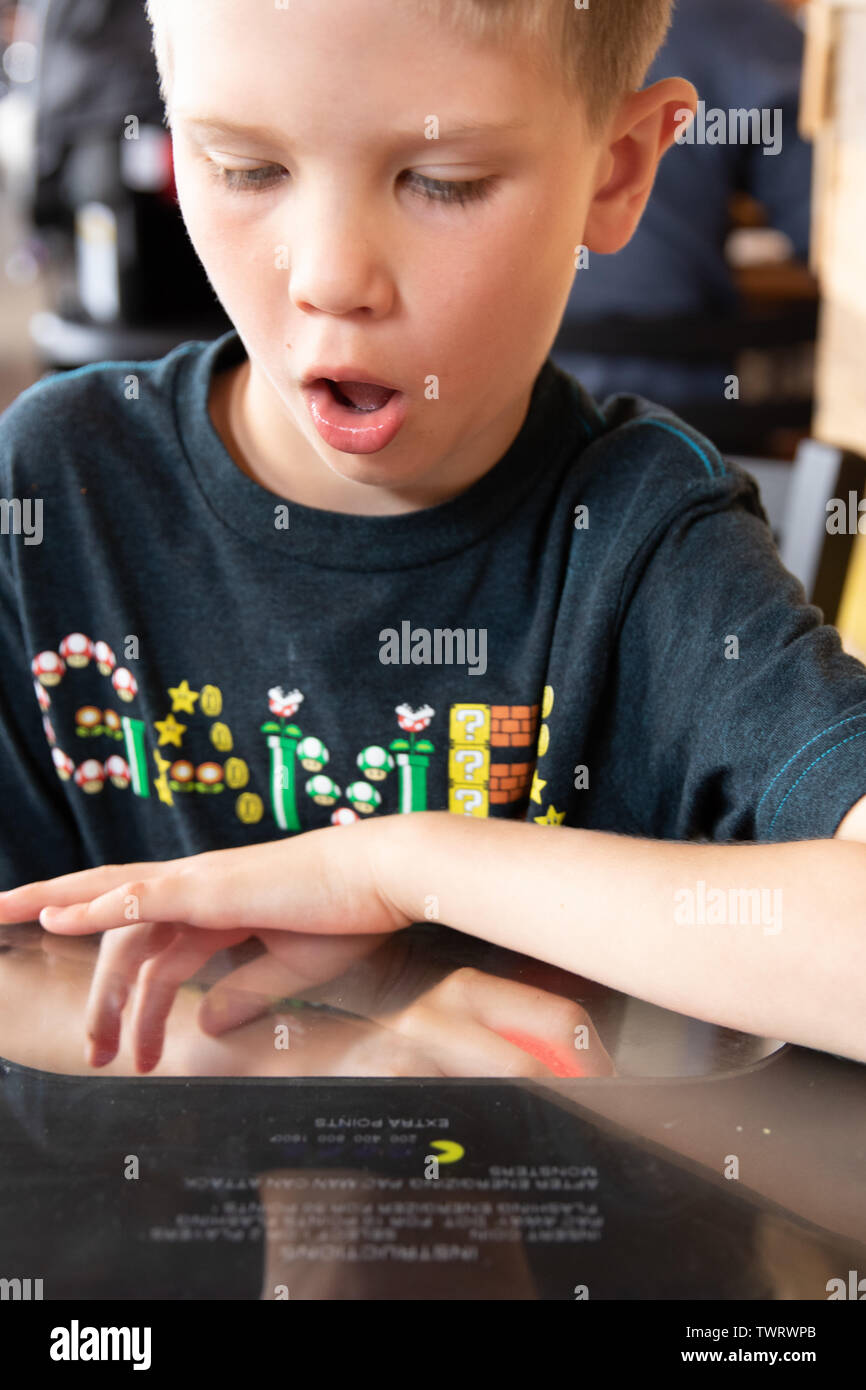 Boy playing video game Stock Photo - Alamy