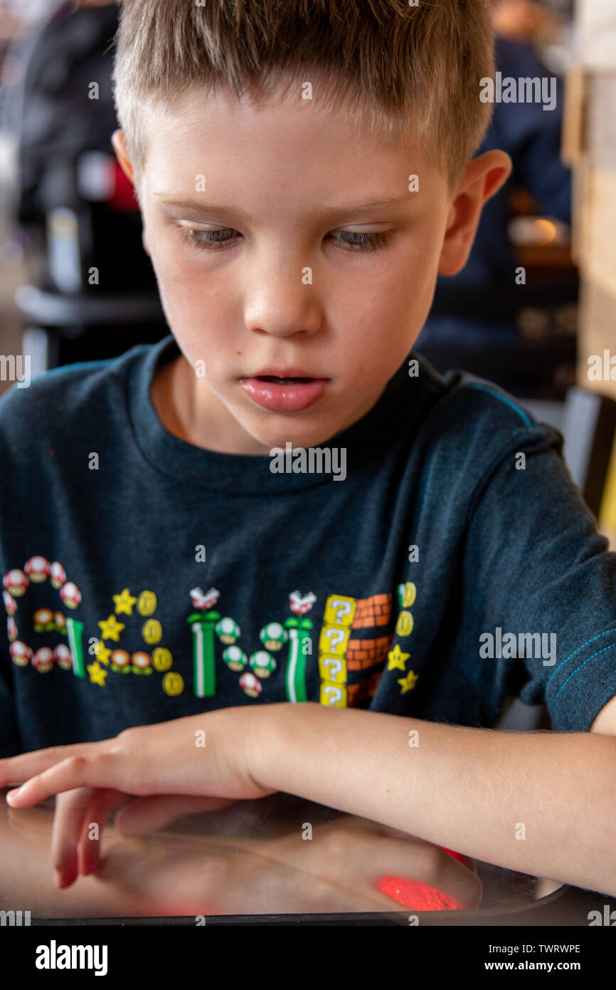 Boy playing video game Stock Photo - Alamy