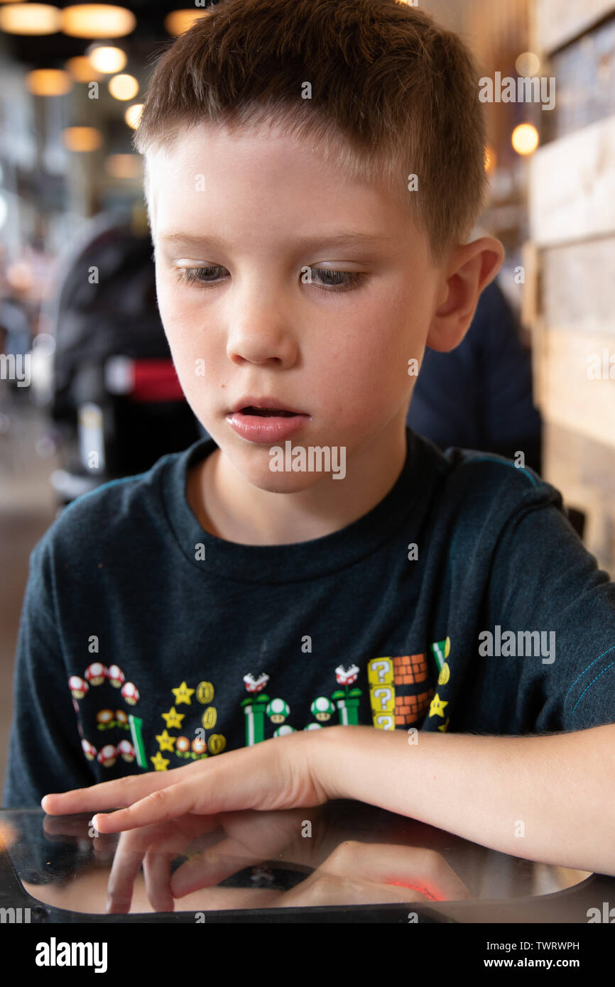 Boy playing video game Stock Photo - Alamy Boy playing video game Stock Photo - Alamy