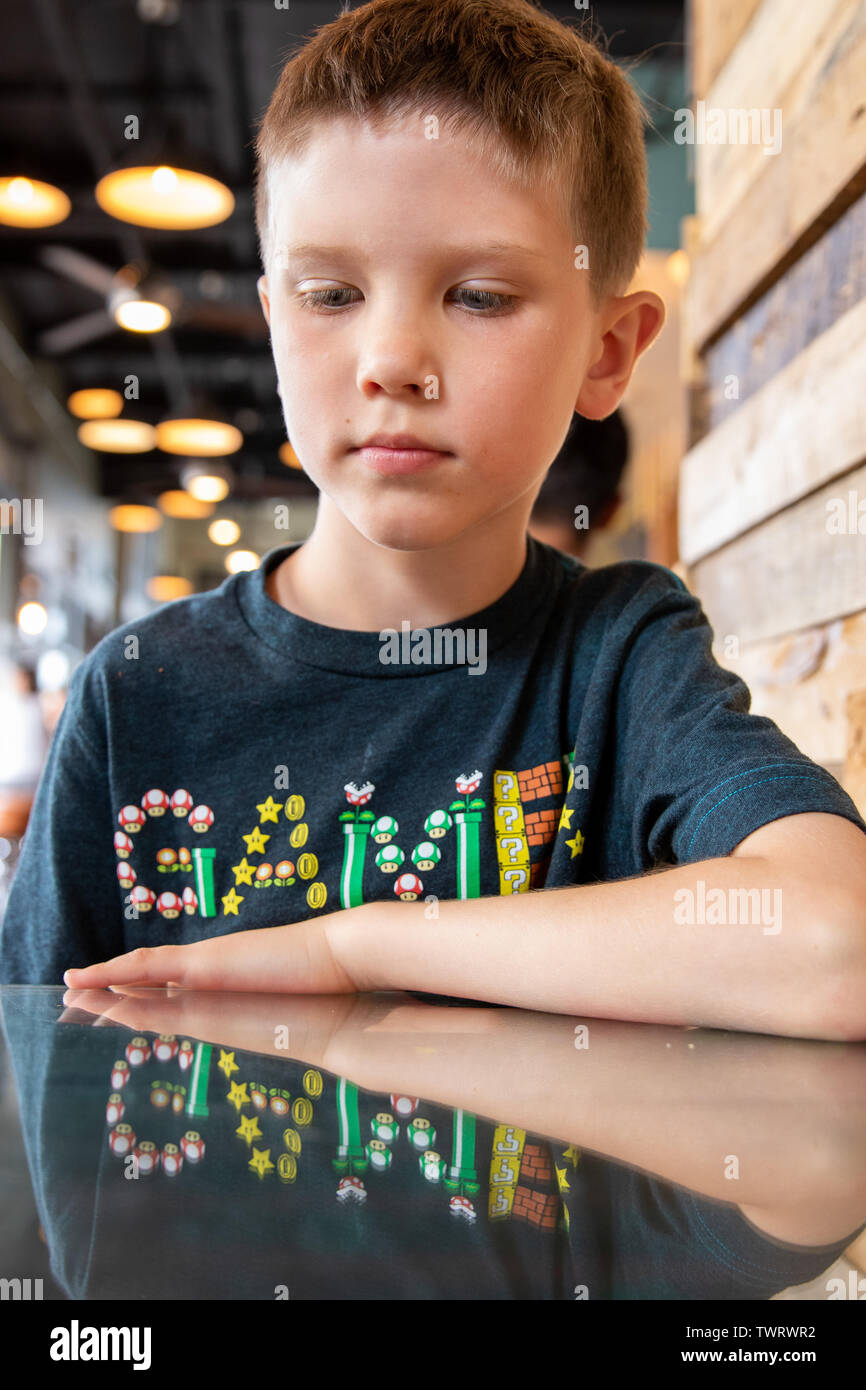 Boy playing video game Stock Photo - Alamy
