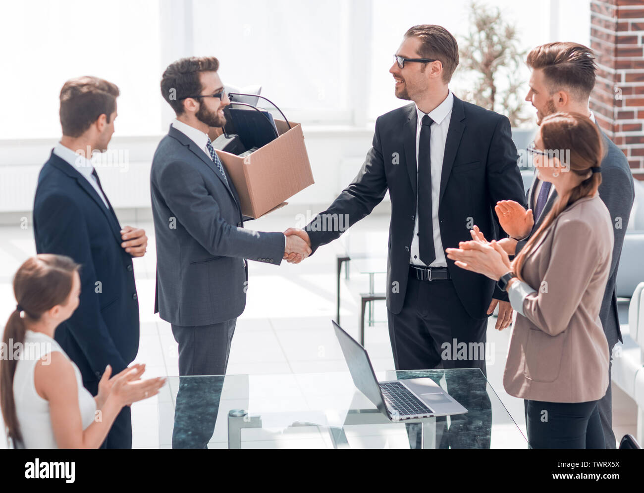 handshake Manager with a new employee in the office Stock Photo - Alamy