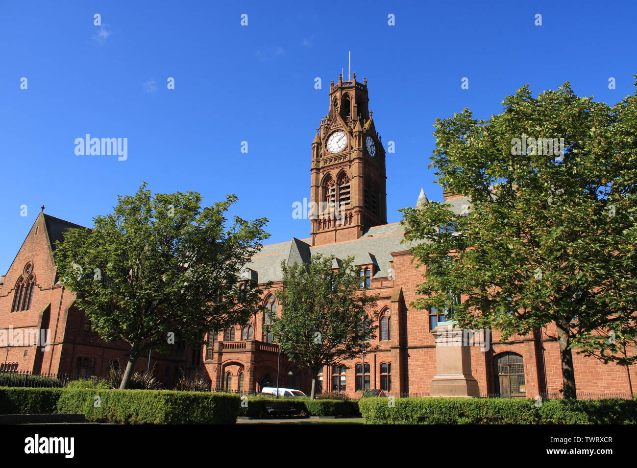UK Barrow-In-Furness, Cumbria. Town Hall and Town Hall clock with blue ...