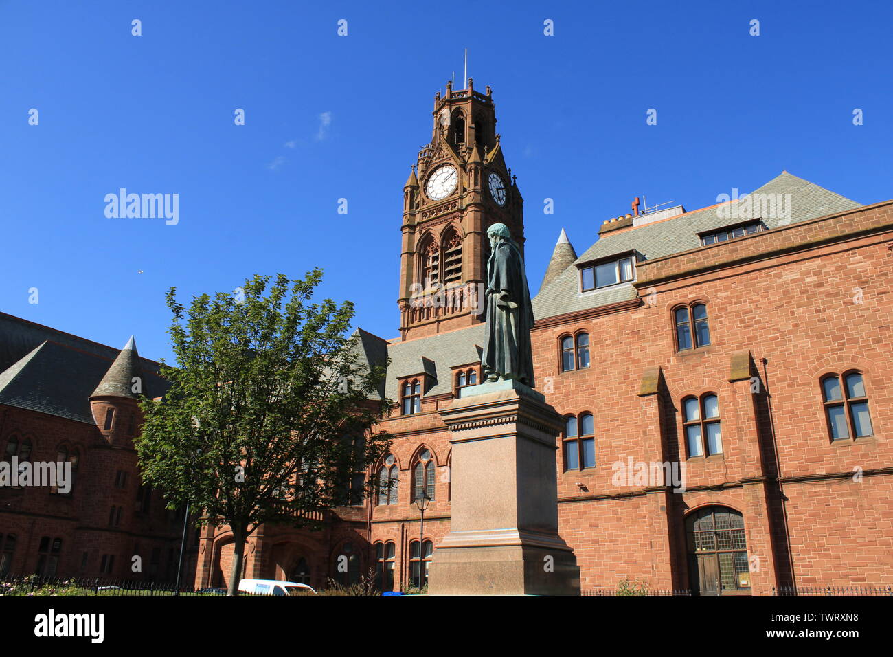 UK Barrow-In-Furness, Cumbria. Town Hall and Town Hall clock with blue ...
