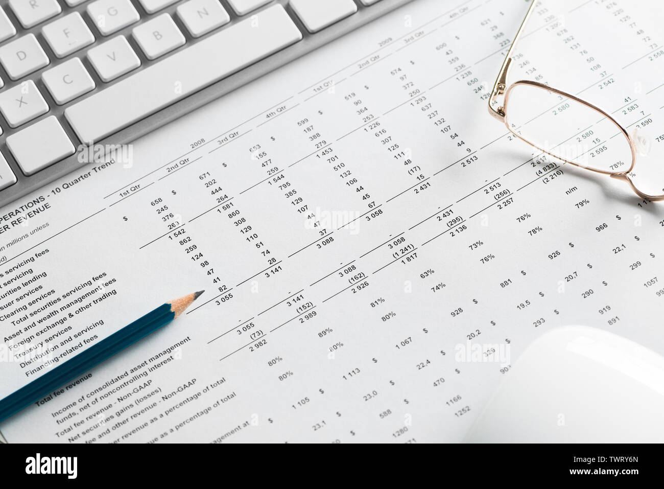 Business workplace with keyboard mouse and papers with graphs and ...