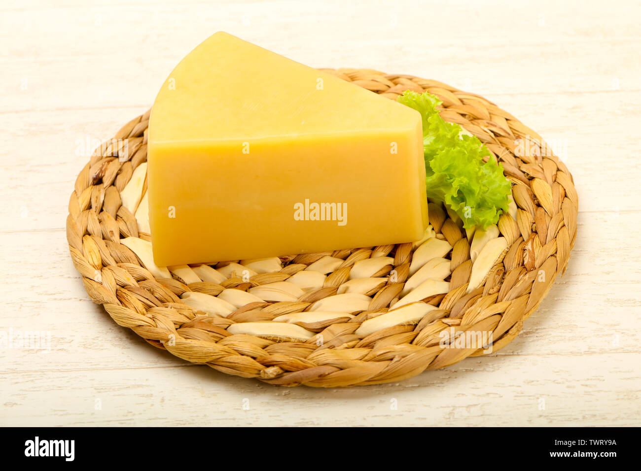 Parmesan cheese triangle Stock Photo - Alamy