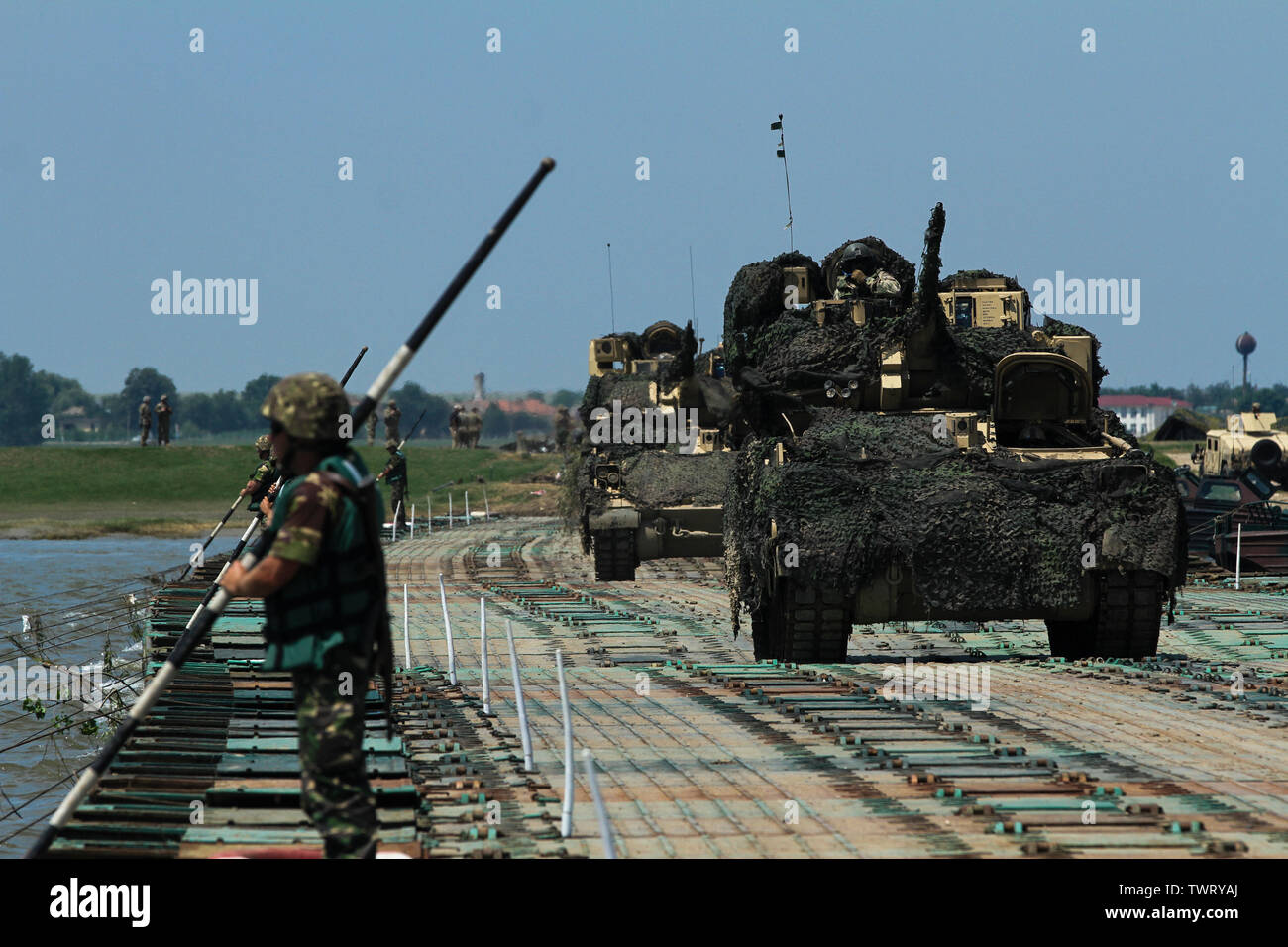Romanian Land Vehicles cross a ribbon bridge during a showcase of ...