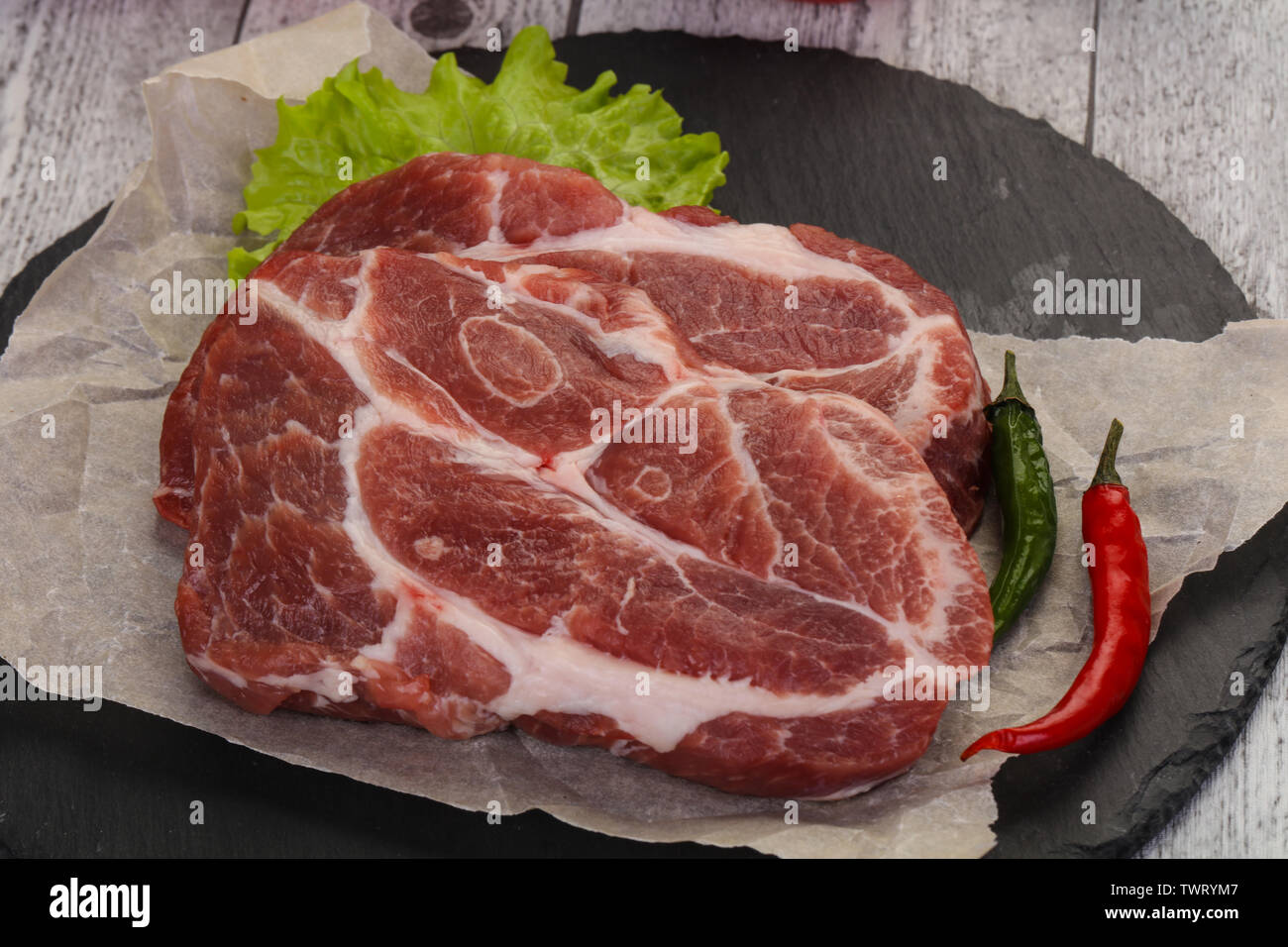 Raw pork neck steak ready for cooking Stock Photo - Alamy