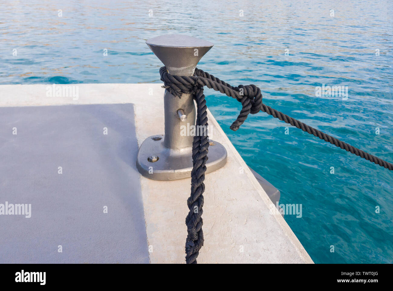 Black rope on a metal bollard Stock Photo - Alamy