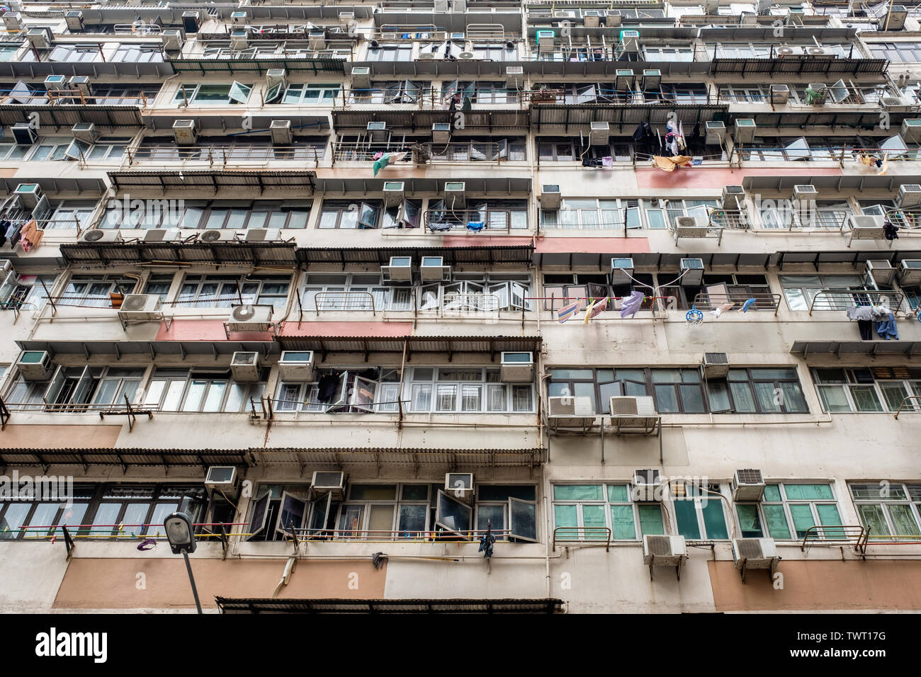 Old surface apartment building with decay windows Stock Photo - Alamy