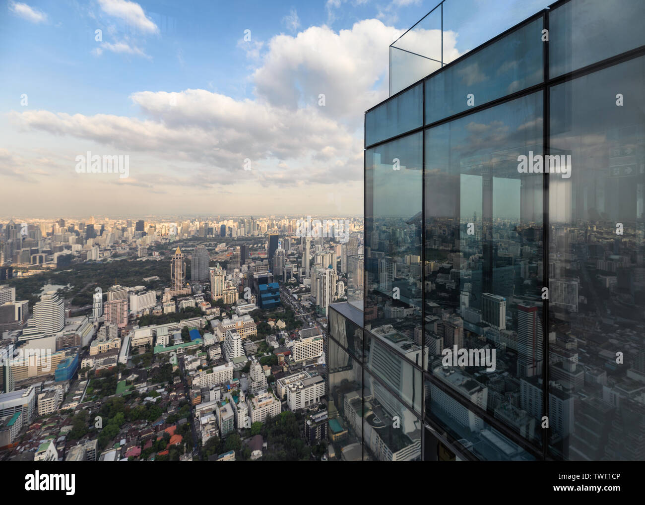 Modern glass building with crowded downtown at bangkok city with blue ...