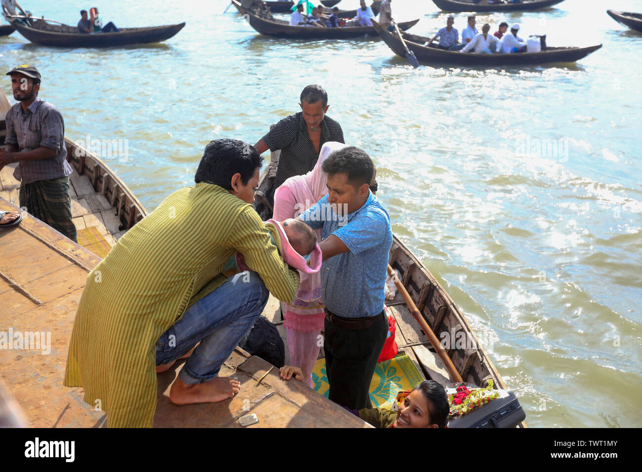 Homebound people struggle to board on a the launch, defying all the ...