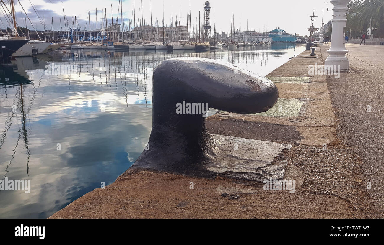 Old big bollard for mooring of ships in port Stock Photo - Alamy
