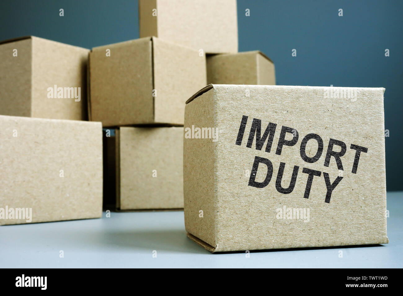 Import duty concept. Pile of cardboard boxes Stock Photo - Alamy