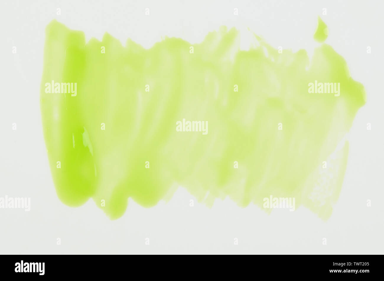 Transparent green paint stain isolated on white background close up ...