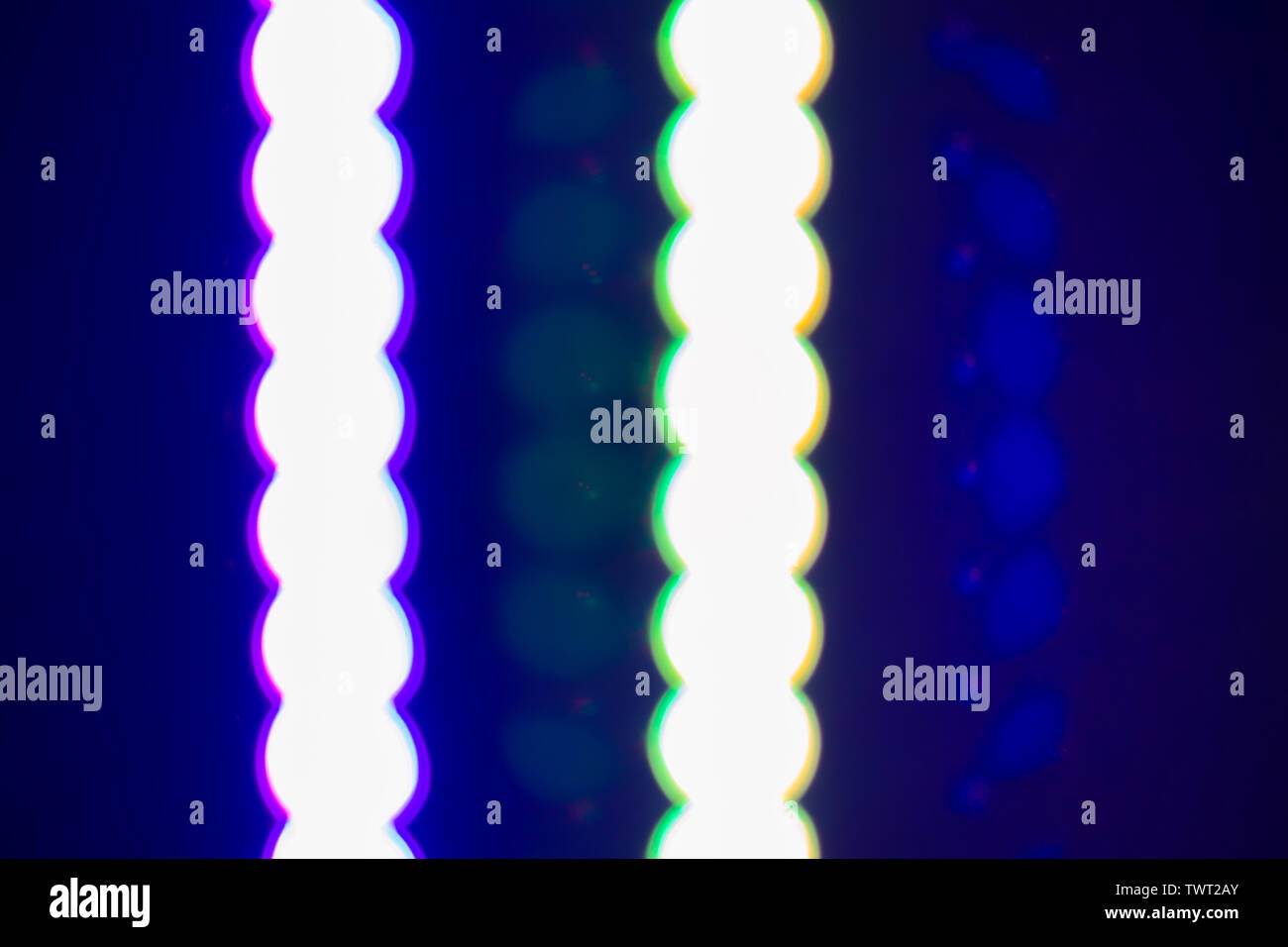 Abstract background of blurred two led strip lights and reflections ...