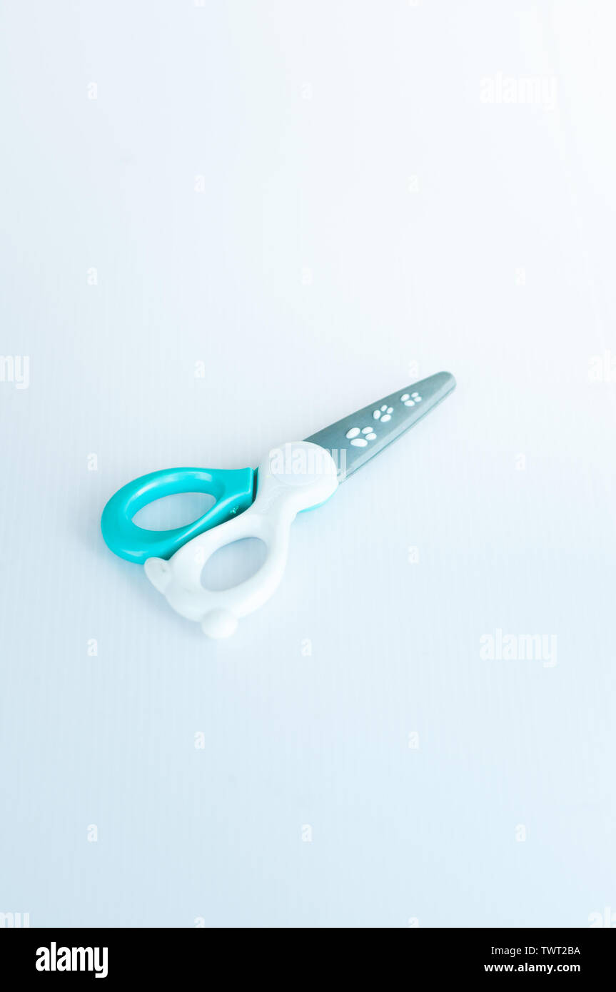 children's colourful safe scissors on a white background. scissors made ...