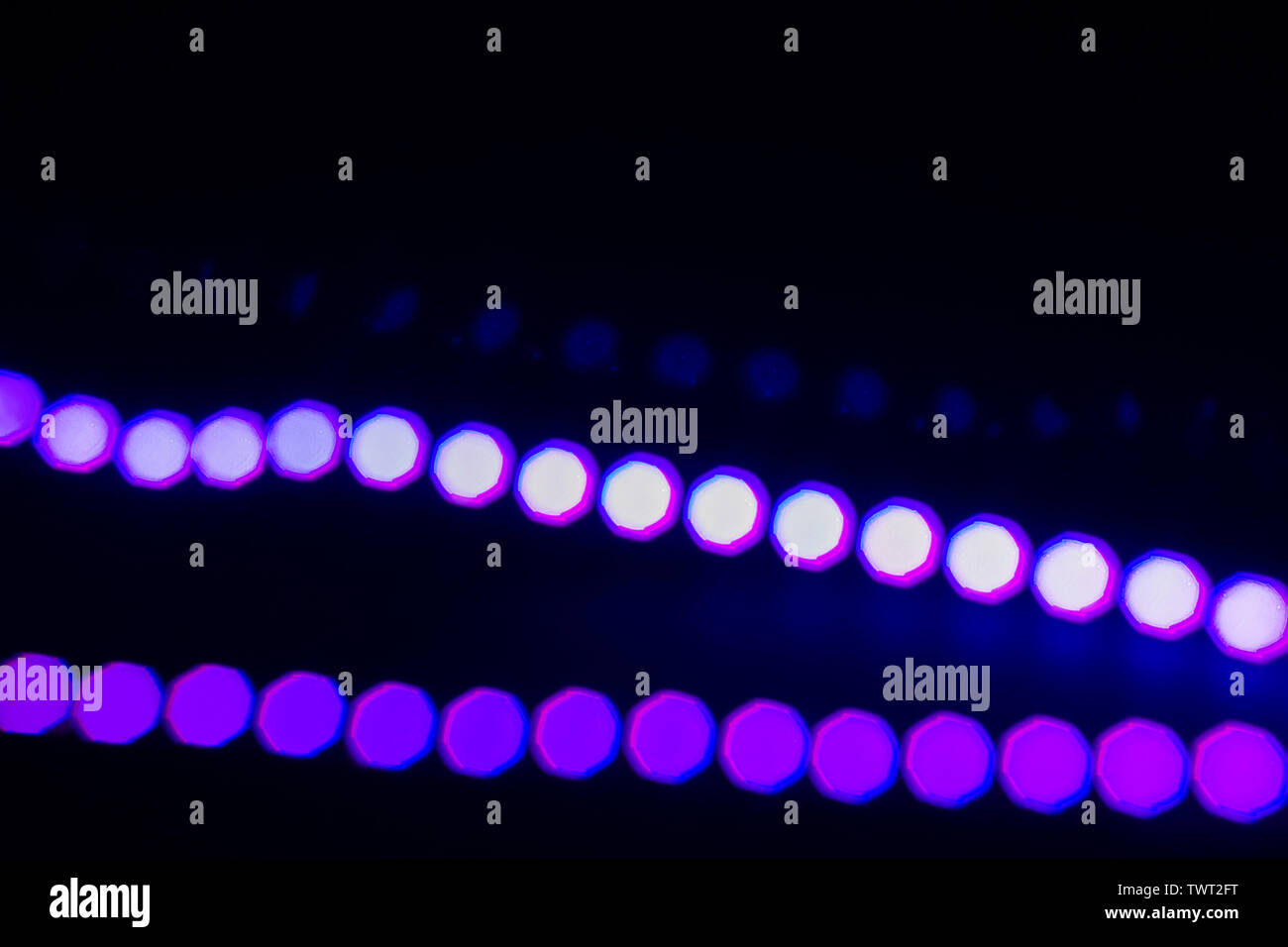 Two neon lines of Violet bokeh lights on black. Abstract background for your design Stock Photo ...