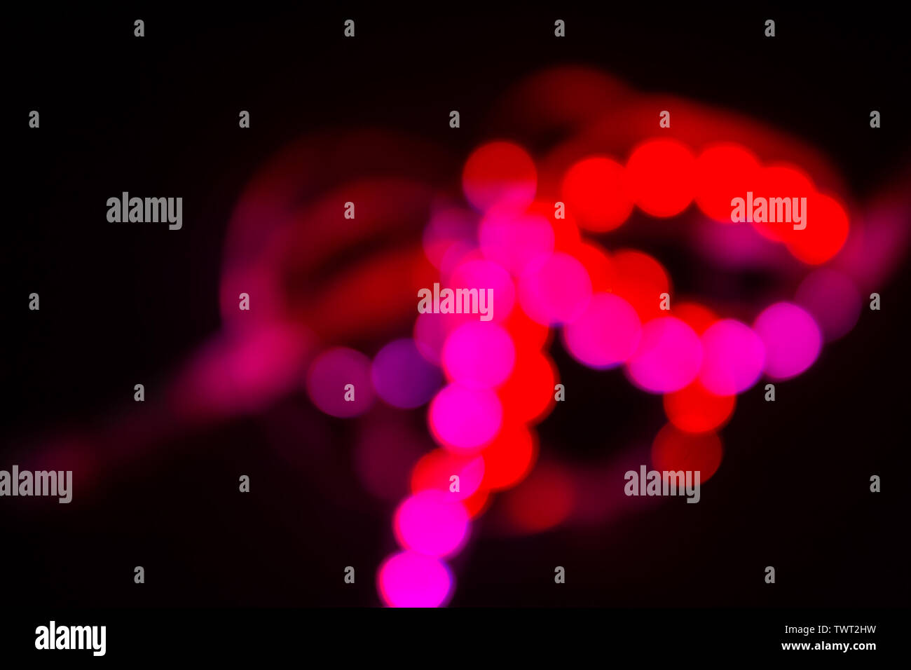 Duotone Red and purple neon lights on black. Abstract blurred ...