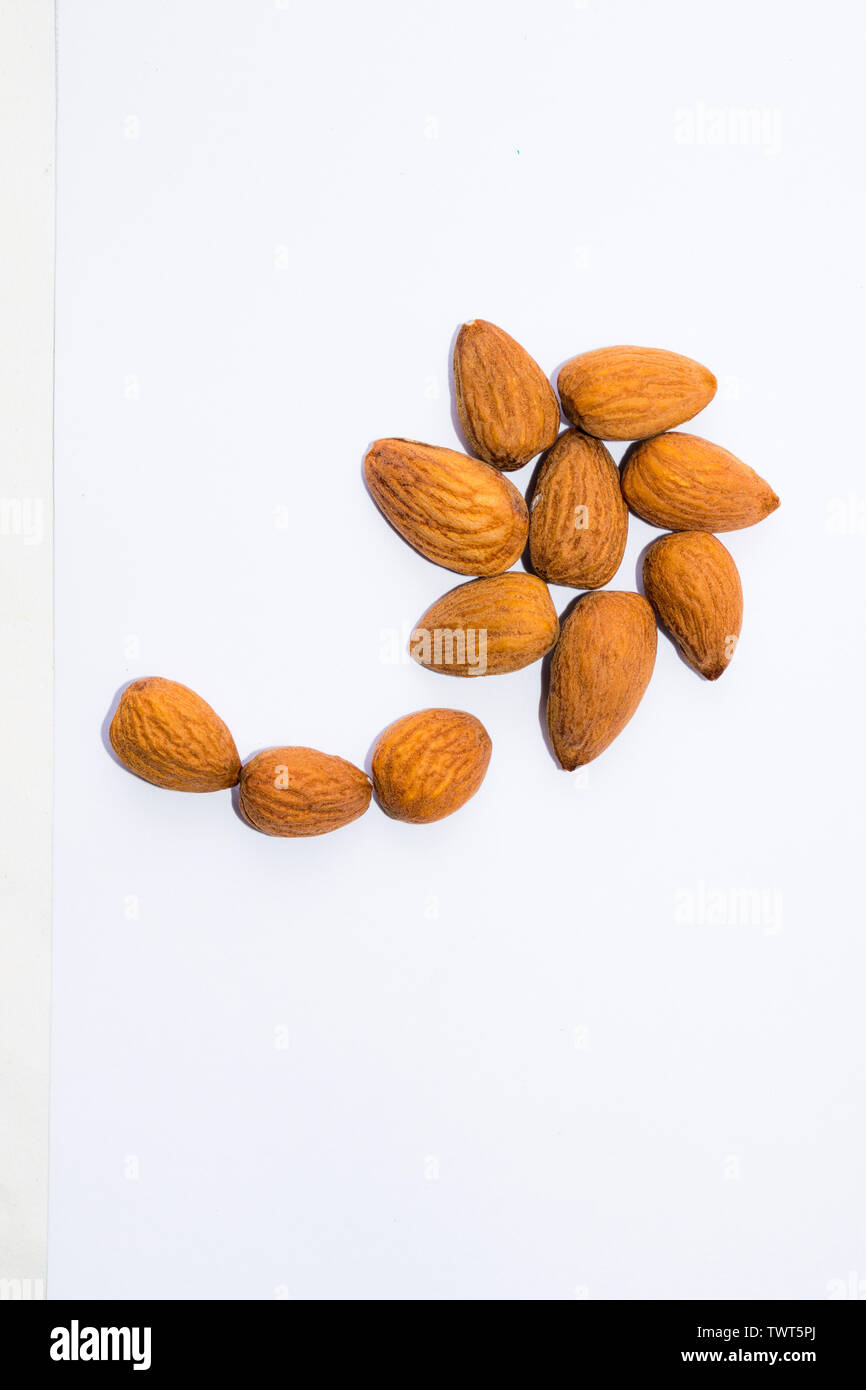 close up of brown almonds seeds isolated on white background,clipping ...