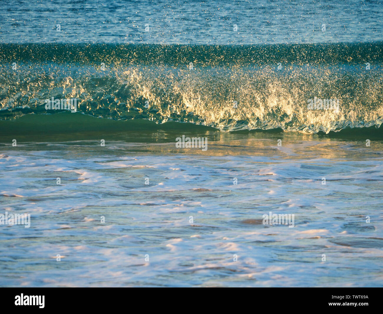 Natural geometry patterns of a tube wave, Sparkling blue green sunlit ...