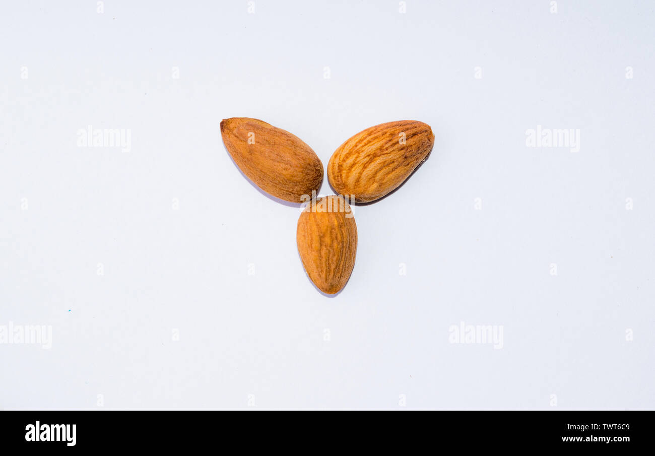 close up of brown almonds seeds isolated on white background,clipping ...
